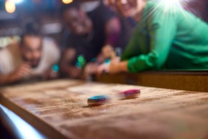 What is Shuffleboard? Rules & How to Play | Boom Battle Bar